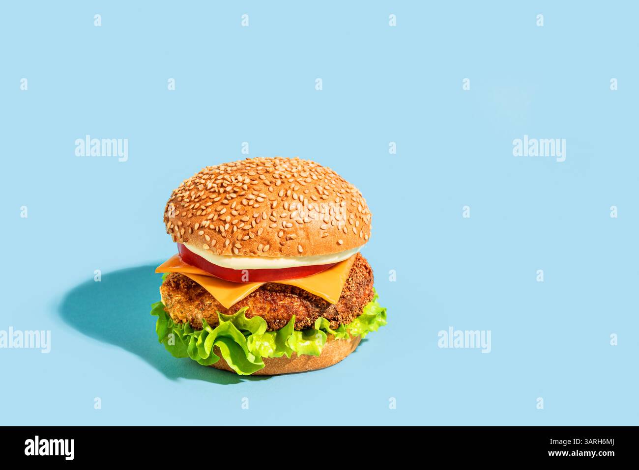 Chicken burger, cheeseburger on blue background, creative design with ...