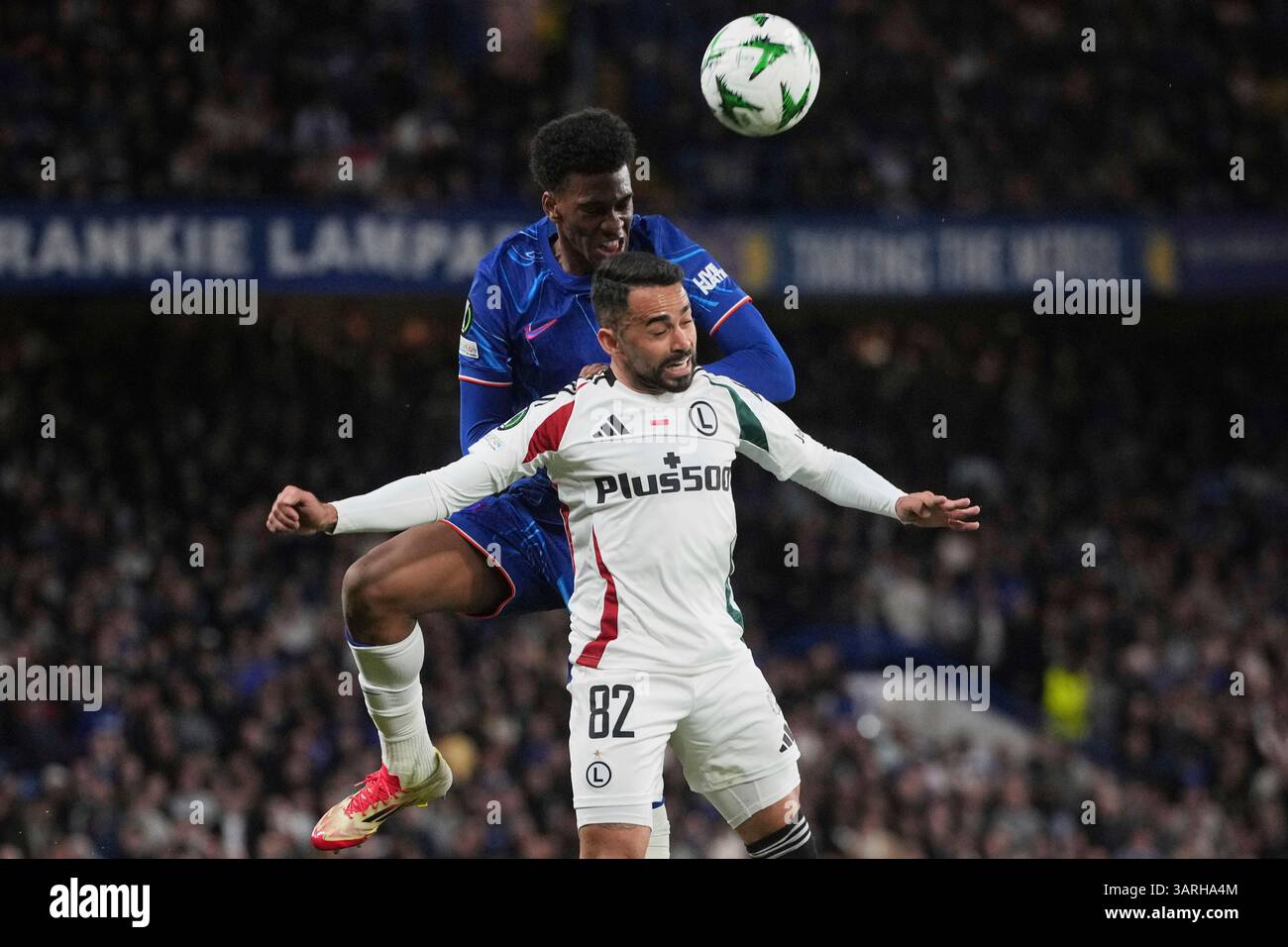 Chelsea's Joshua Acheampong heads the ball above Legia's Luquinhas during the Europa Conference ...
