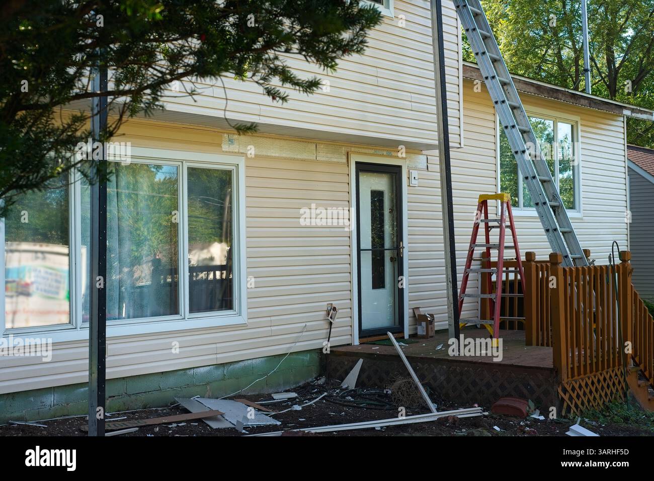 Installation of new vinyl siding is nearing completion on the front of ...