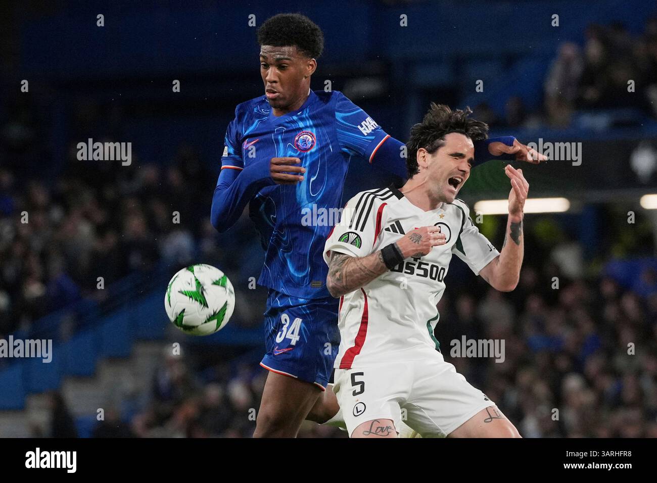 Chelsea's Joshua Acheampong vies for the ball with Legia's Claude ...