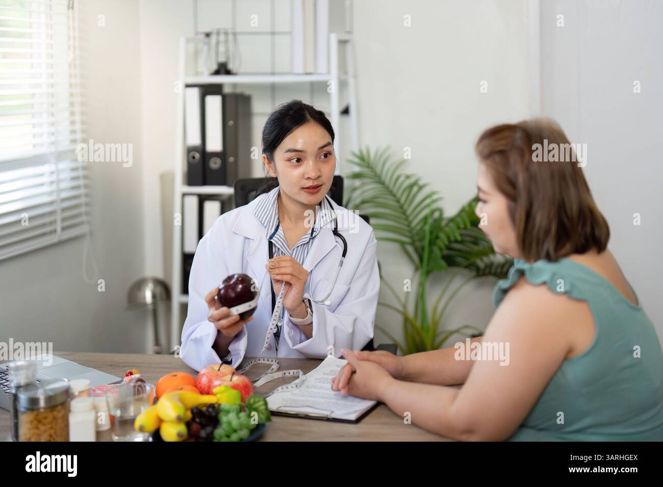 Dietary Counseling and Nutrition Guidance. A nutritionist explaining ...