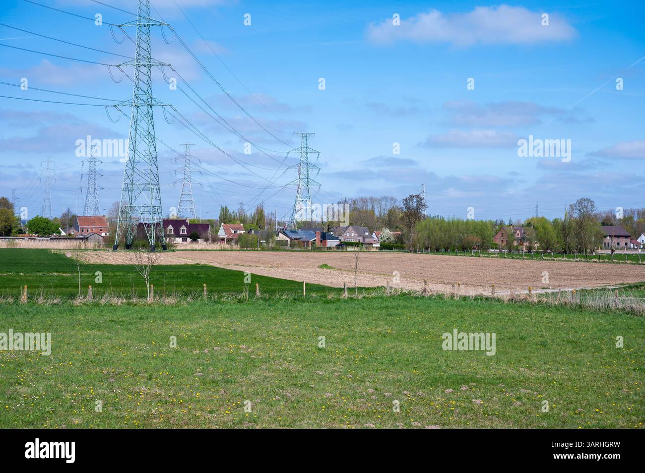 Green fields and brown soil at the Flemish countryside in Avelgem, West ...