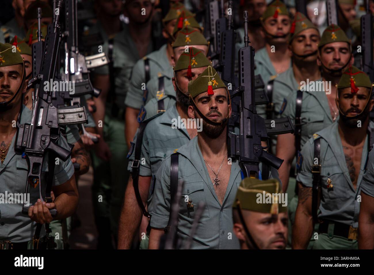 A group of legionnaires parade with their rifles during the transfer of ...