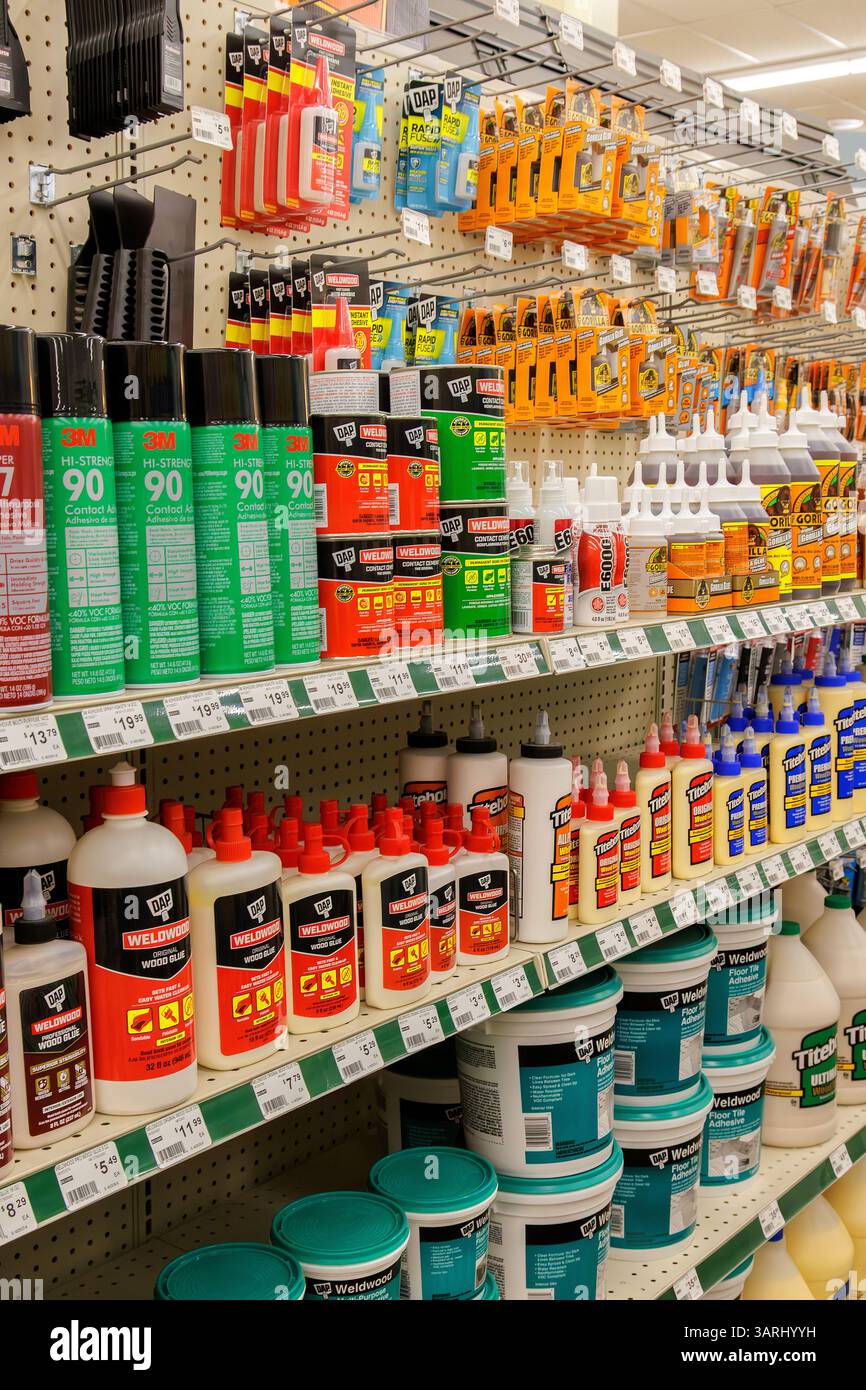 Various glues and adhesives inside Hardware store Stock Photo - Alamy