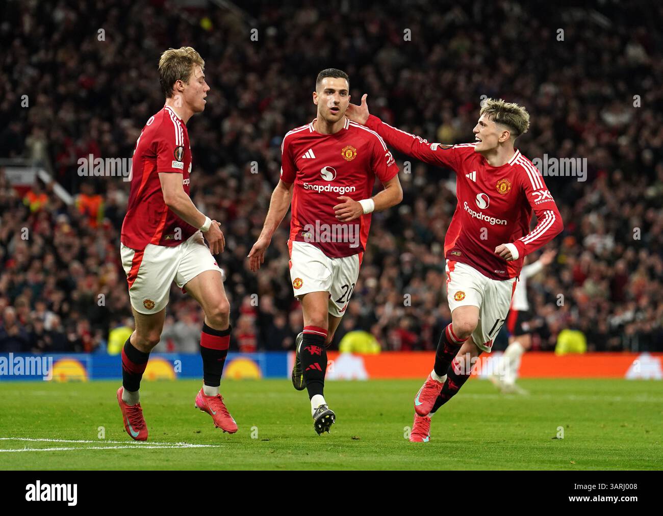 Manchester United's Diogo Dalot (centre) celebrates scoring their side ...