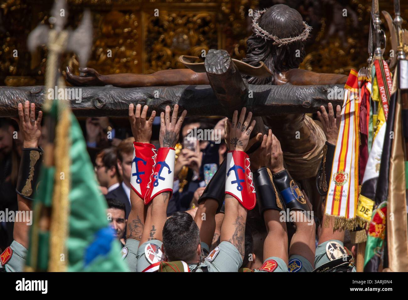 Malaga, Spain. 17th Apr, 2025. A group of legionnaires carry the Christ ...