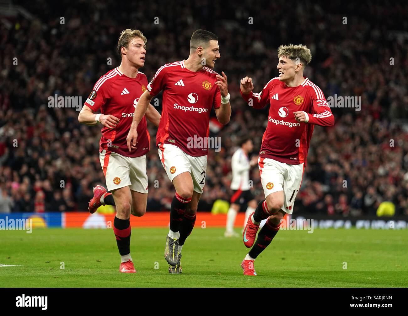 Manchester United's Diogo Dalot (centre) celebrates scoring their side ...