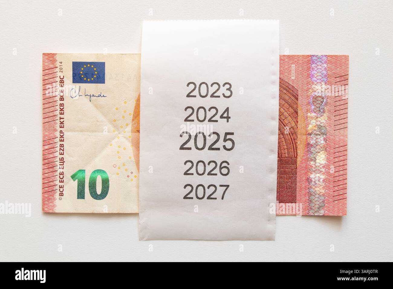 Ten euro banknote and check with years from 2023 to 2027 on white ...