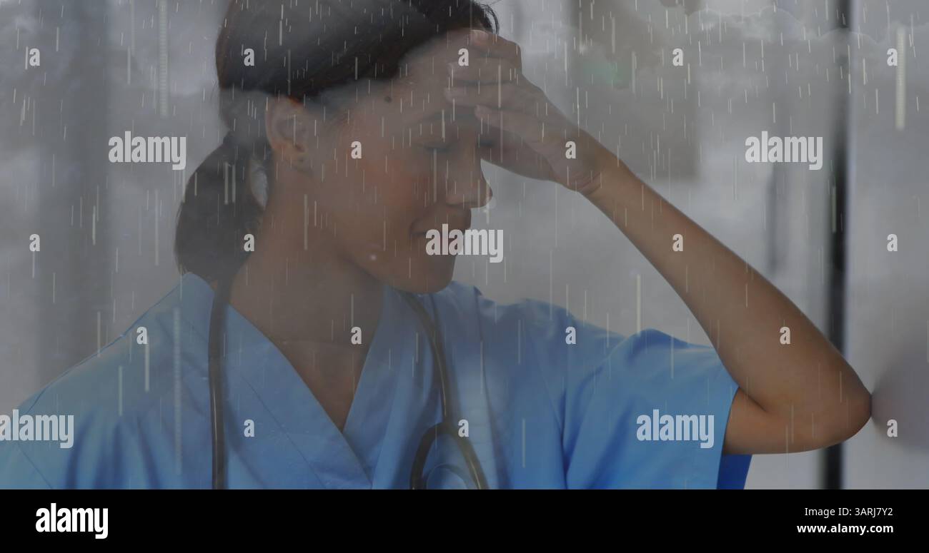 Image of clouds and rain over sad biracial female nurse in hospital ...
