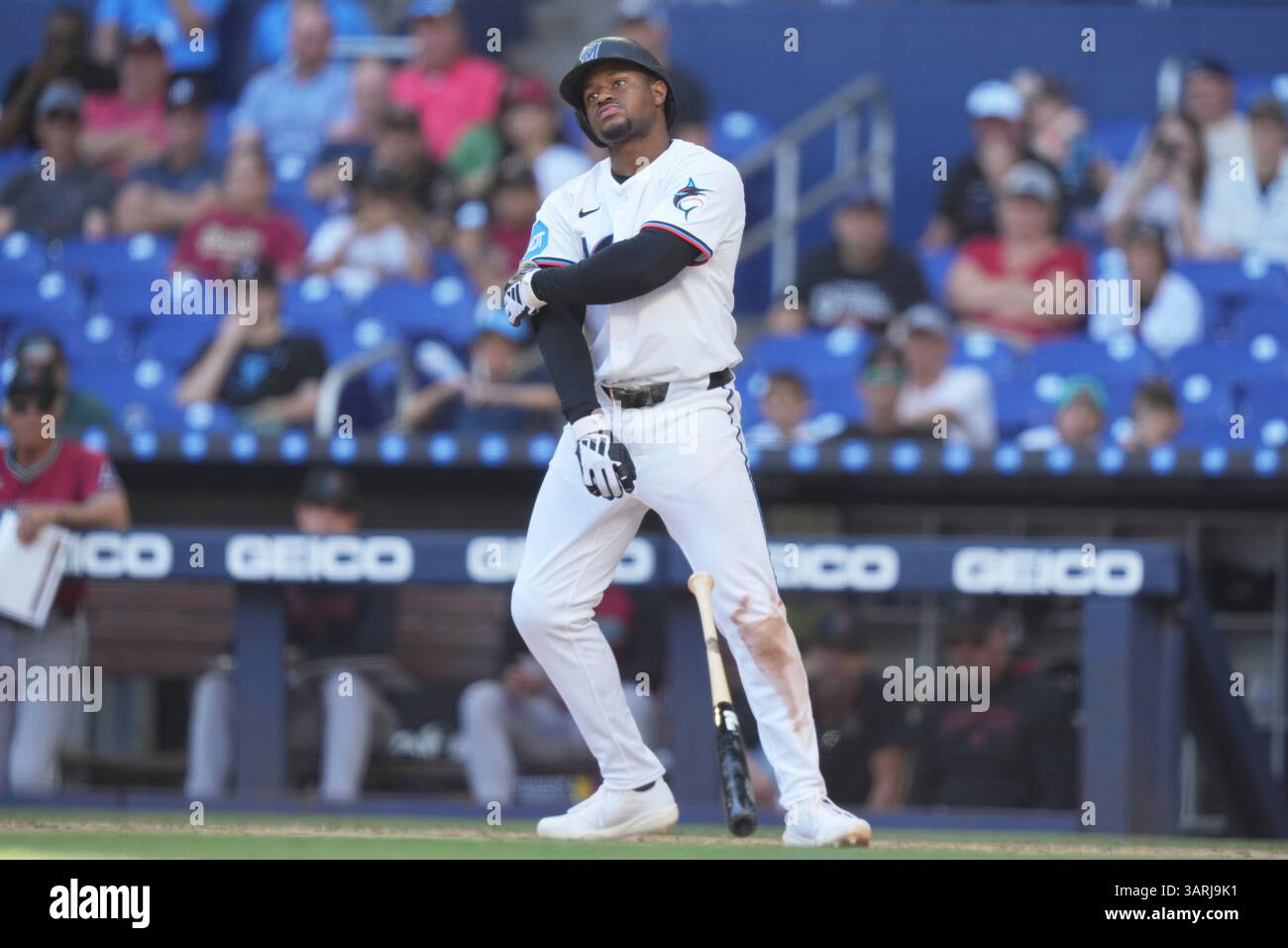 Miami Marlins' Xavier Edwards tosses his bat after drawing a walk to ...
