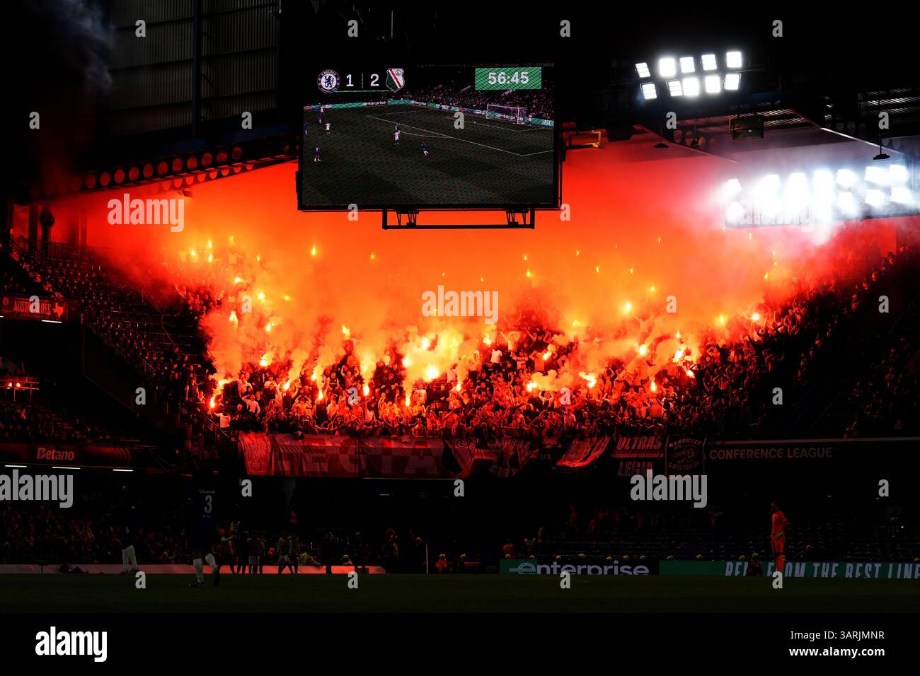 Legia Warsaw fans let off flares in the stands during the UEFA ...