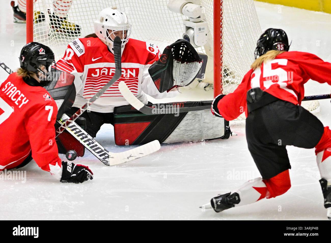 L-R Laura Stacey (CAN), goalkeeper Miyuu Masuhara (JPN) and Daryl Watts ...