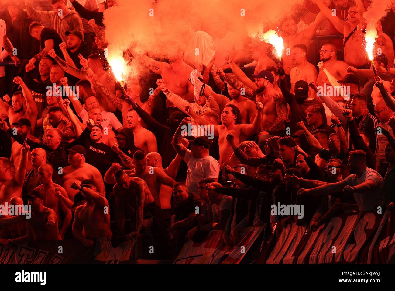 London, England, April 17th 2025: Legia Warszawa fans light up flares ...