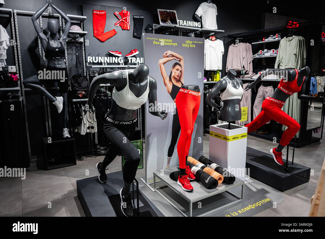Khmelnytskyi, Ukraine - April 16, 2025: Modern athletic store interior featuring mannequins with ...