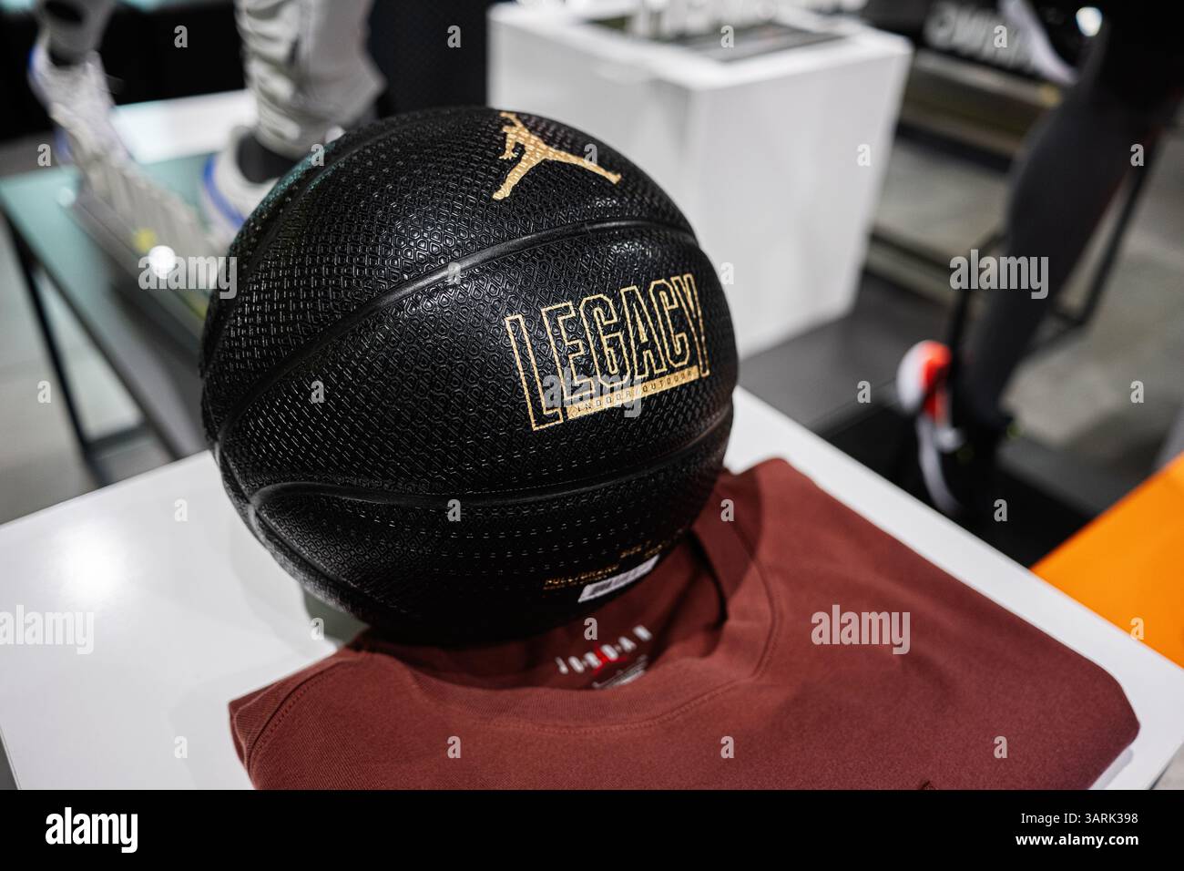 Khmelnytskyi, Ukraine - April 16, 2025: A black basketball featuring a gold Jordan Legacy logo ...