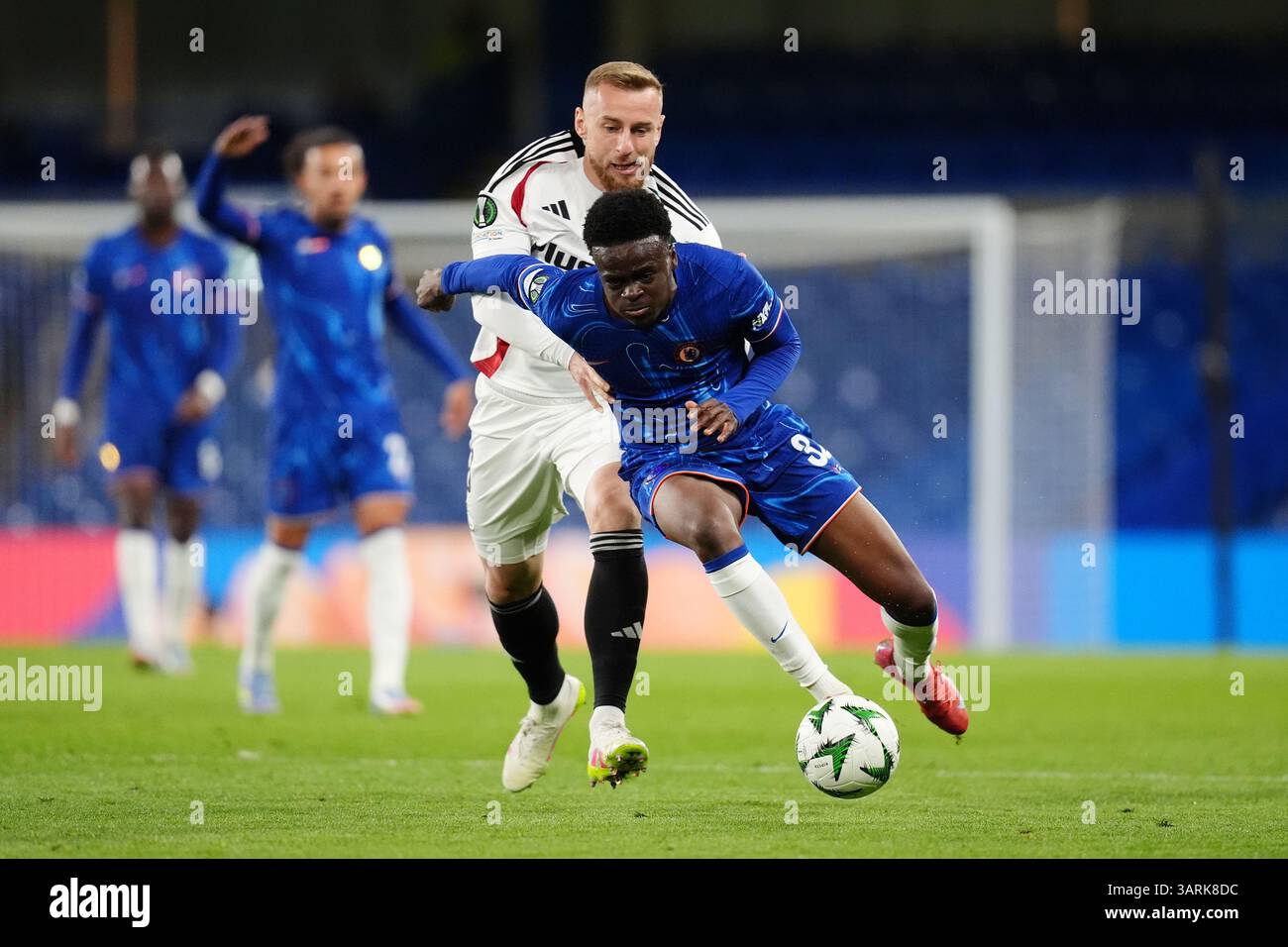 Chelsea's Tyrique George (right) and Legia Warsaw's Rafal Augustyniak battle for the ball during ...