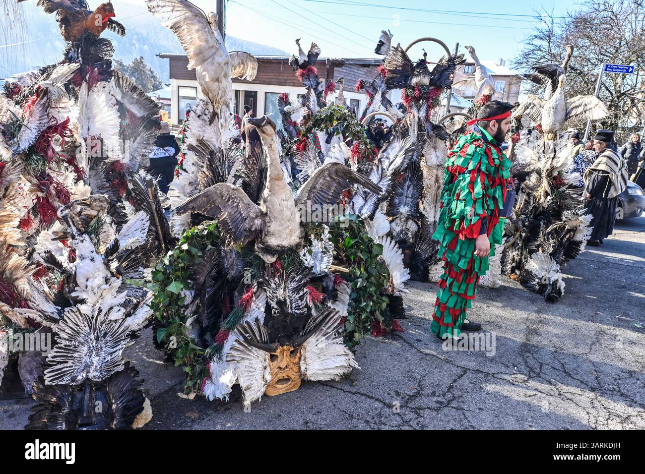 A close-up of a traditional Kuker mask reveals the intricate ...