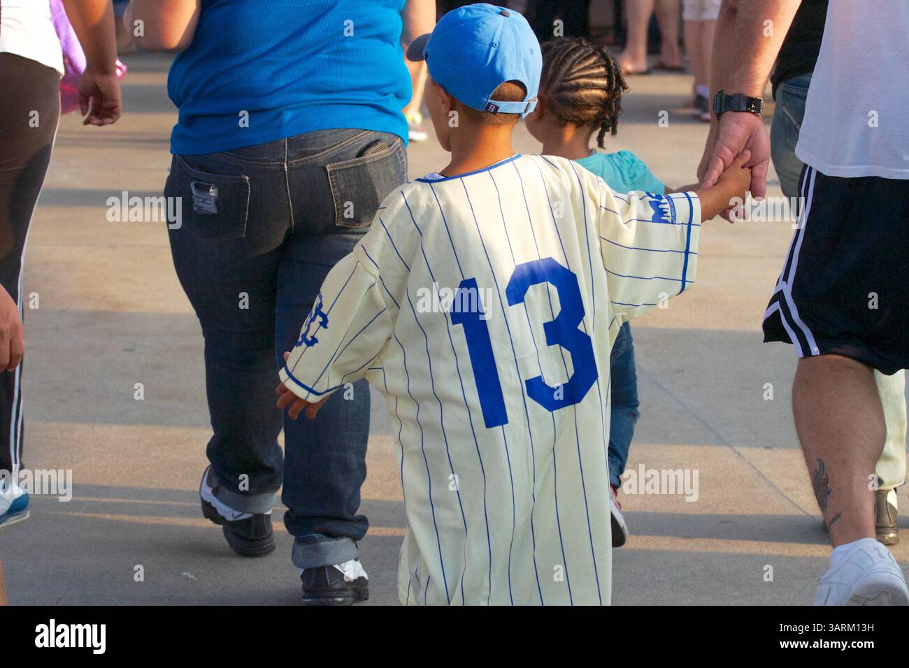 Aug. 29, 2013 - New York, New York, U.S - This young baseball fan wears ...