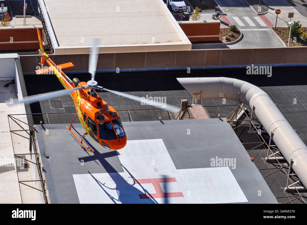 Bright orange helicopter landing hi-res stock photography and images ...