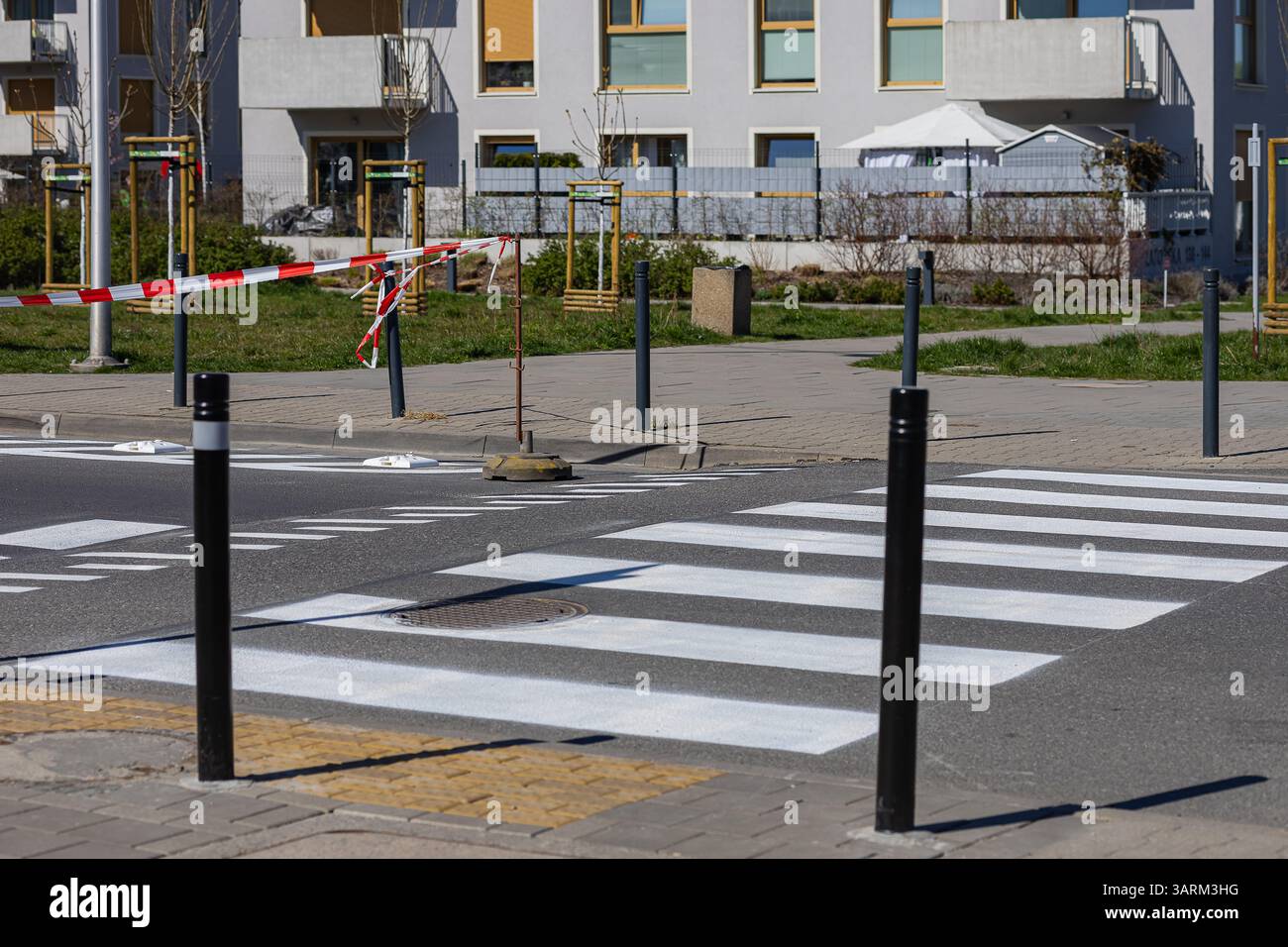Newly renovated pedestrian crosswalk in modern residential area with ...