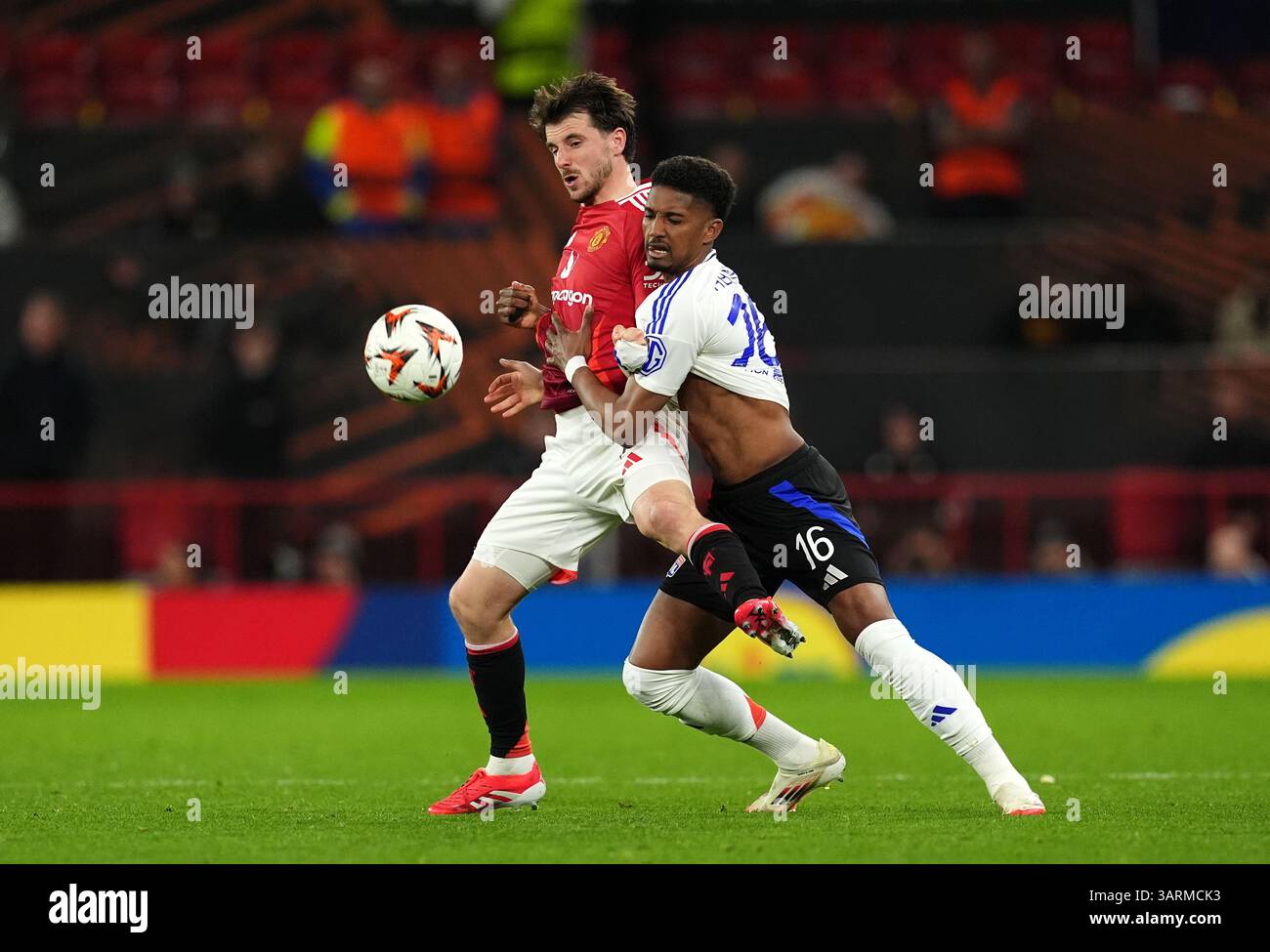 Manchester United's Mason Mount and Lyon's Abner battle for the ball ...