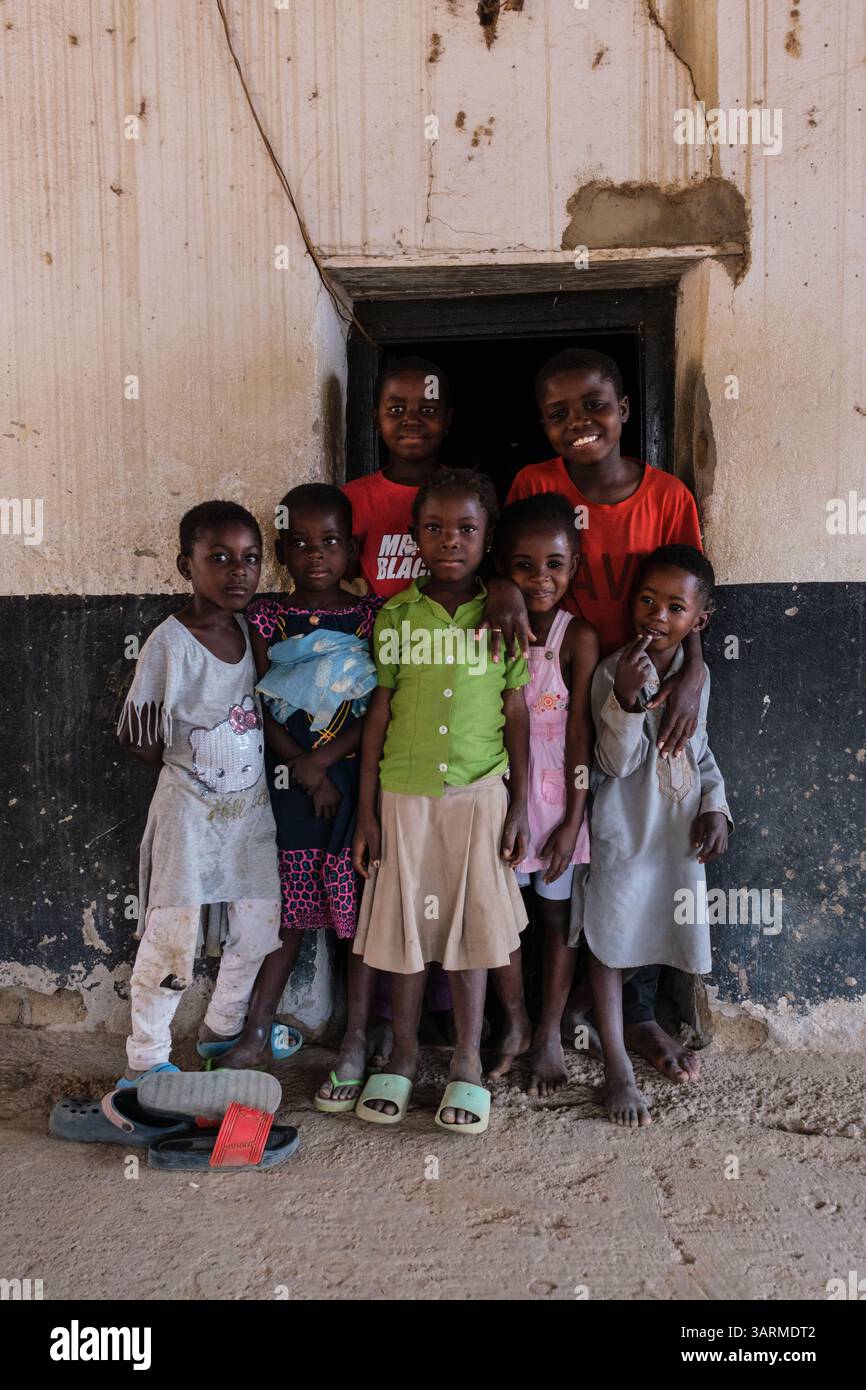 Ghana, Maluwe Mosque, in the Sudanic Style. Children of Maluwe in front ...