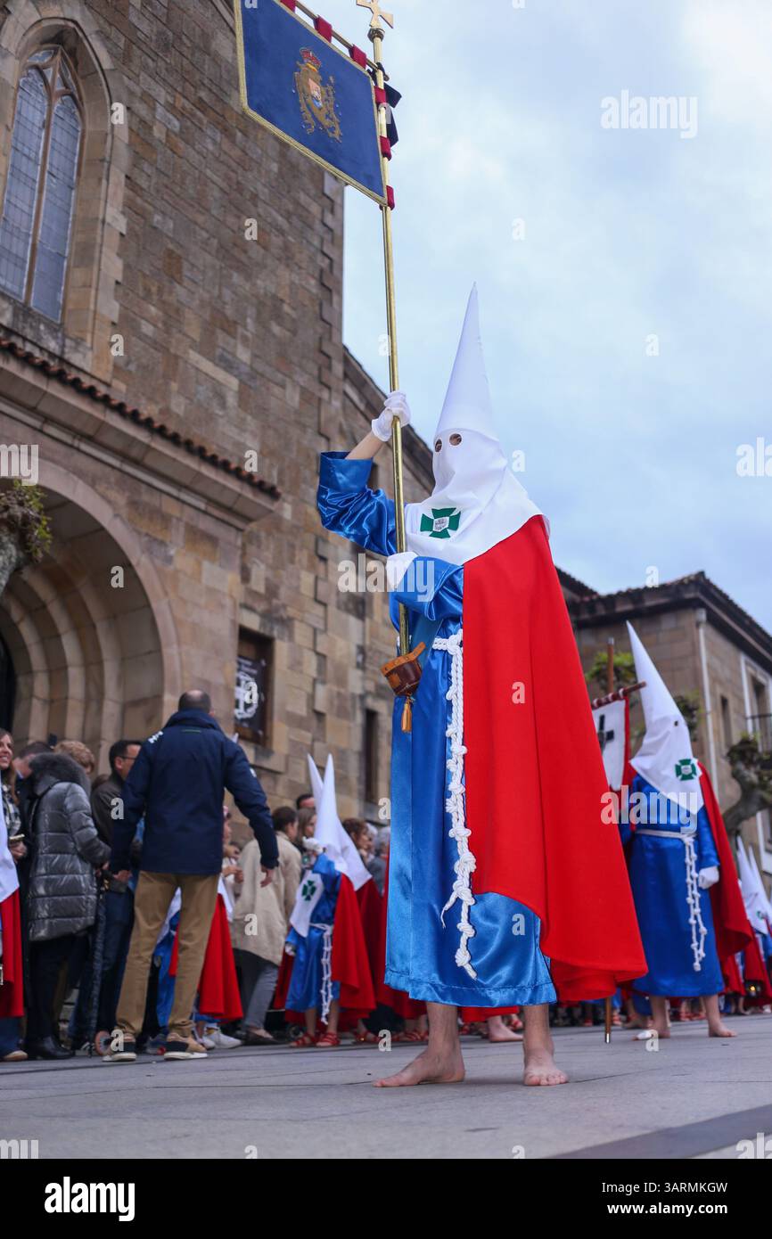 Avilés, Spain, April 17, 2025: A Nazarene with one of the pennants ...