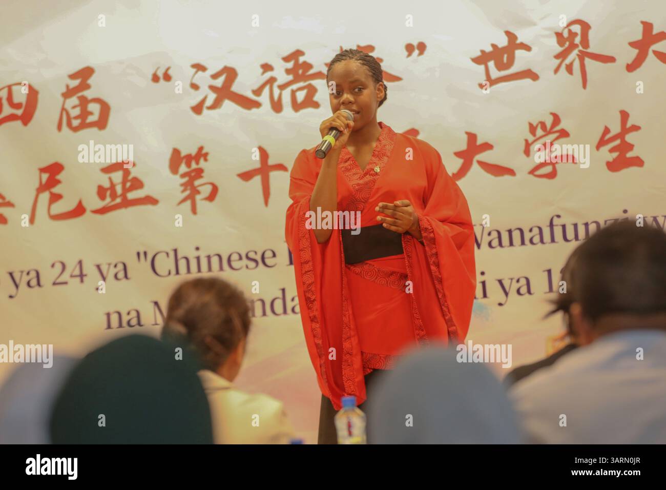 Dar Es Salaam, Tanzania. 16th Apr, 2025. A Tanzanian student performs ...
