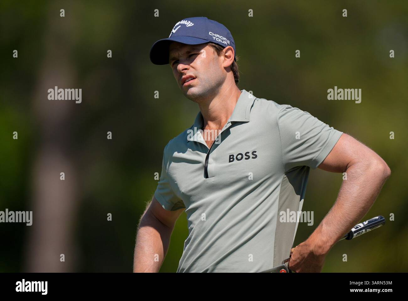 Thomas Detry, of Belgium, reacts to his putt on the 17th green during ...