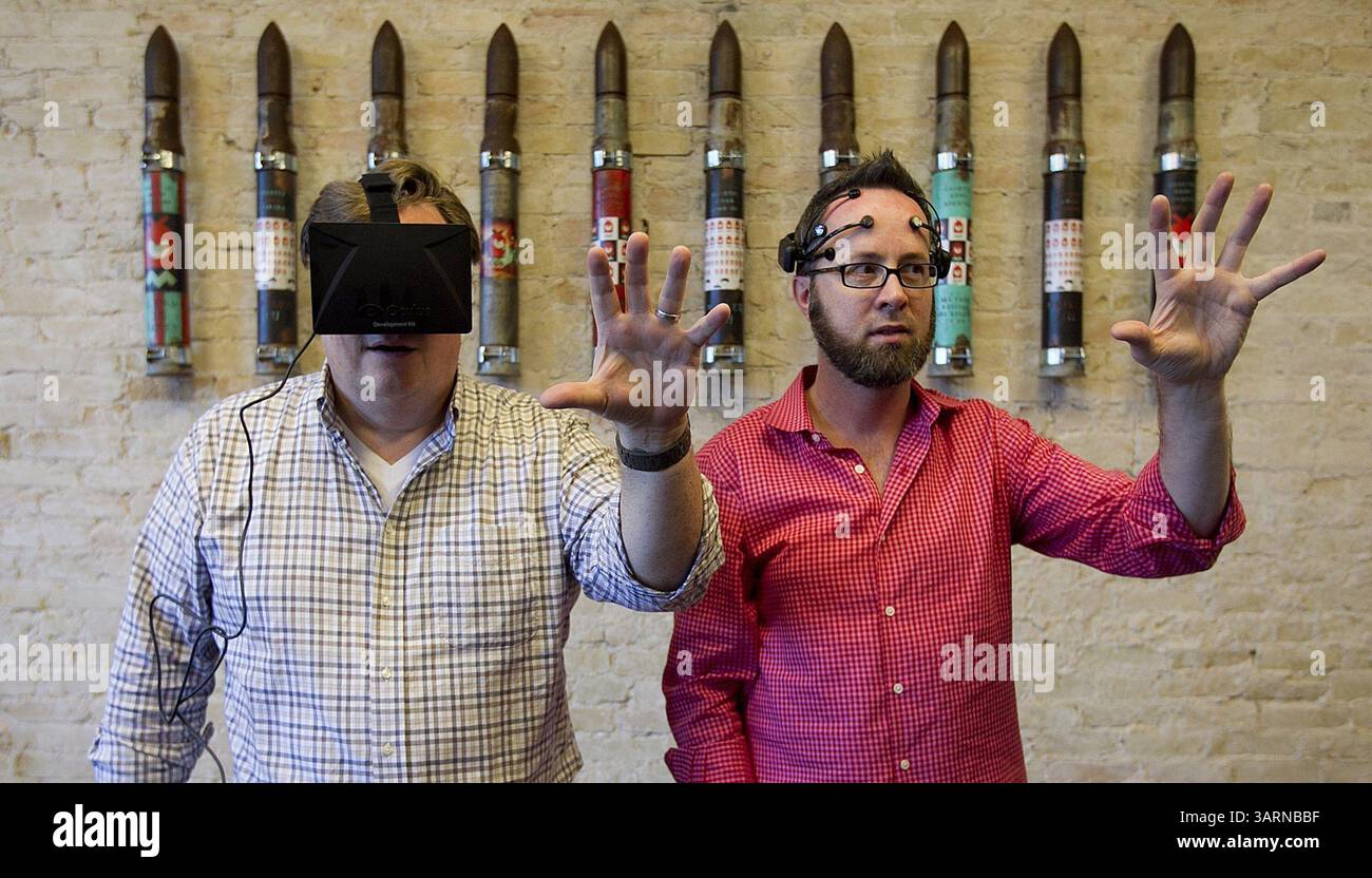 Oct. 11, 2013 - Austin, TX, USA - CK Sample, left, wears an Oculus Rift ...