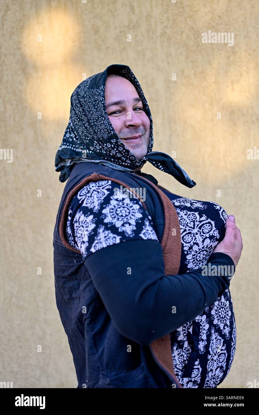 A Kukeri performer parades through Breznik dressed in traditional ...