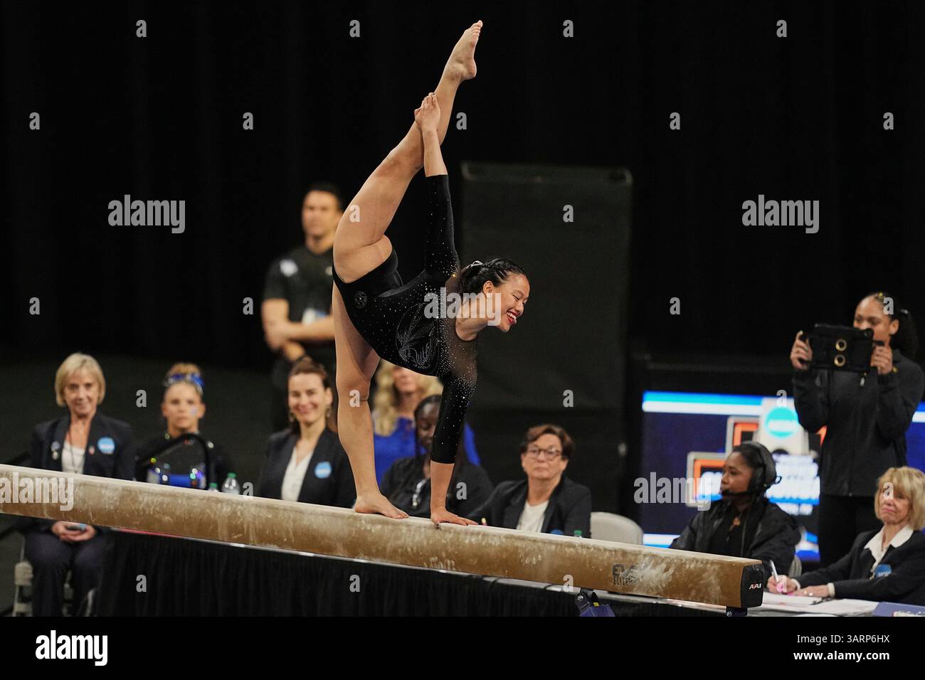 Missouri's Helen Hu competes on the balance beam during the NCAA women ...