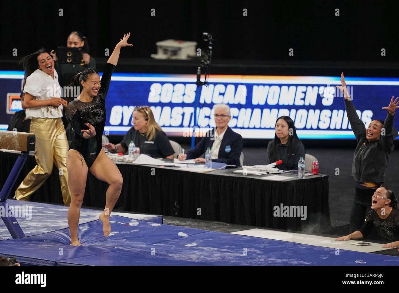 Missouri's Helen Hu celebrates after competing on the balance beam ...