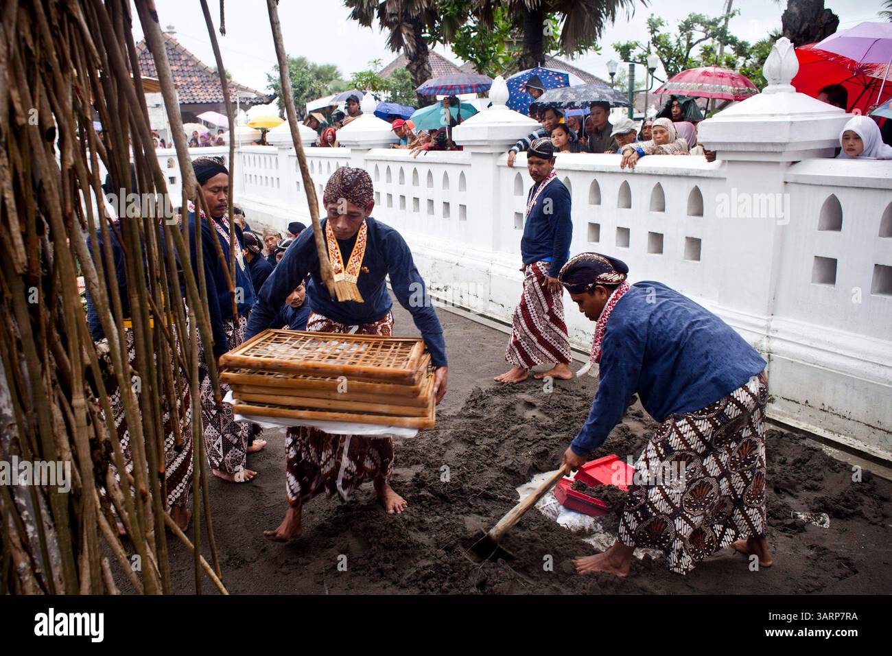 Royal Servants wearing traditional Javanese costume takes part in ...