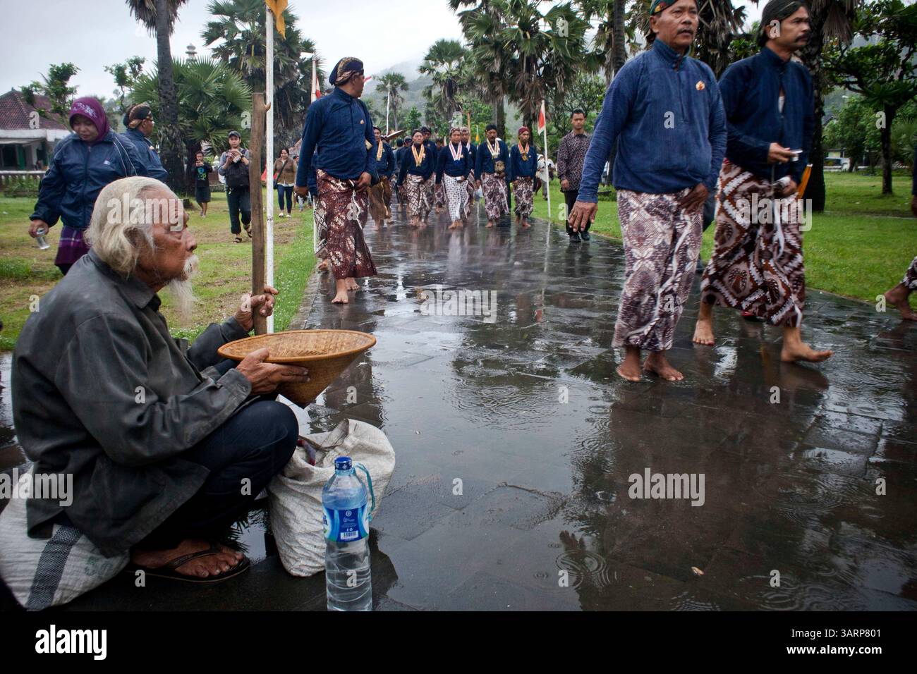 Royal Servants wearing traditional Javanese costume takes part in ...