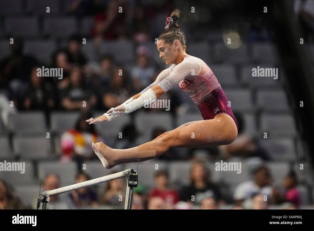 Oklahoma's Jordan Bowers competes on the uneven bars during the NCAA ...