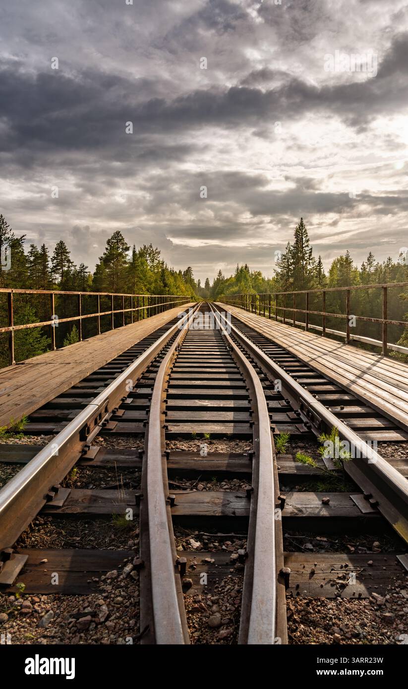 Railway bridge crosses river Ämån in Orsa Dalarna Sweden, showcasing ...