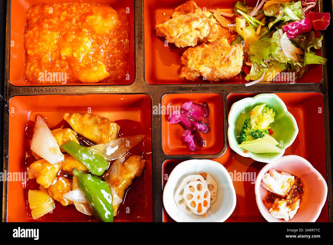 Luxurious Chinese lunch box with fried chicken, sweet-and-sour pork ...