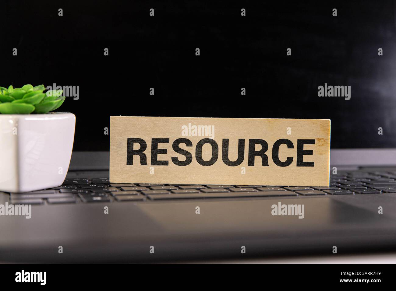 Resources Word In Wooden Cube Stock Photo - Alamy