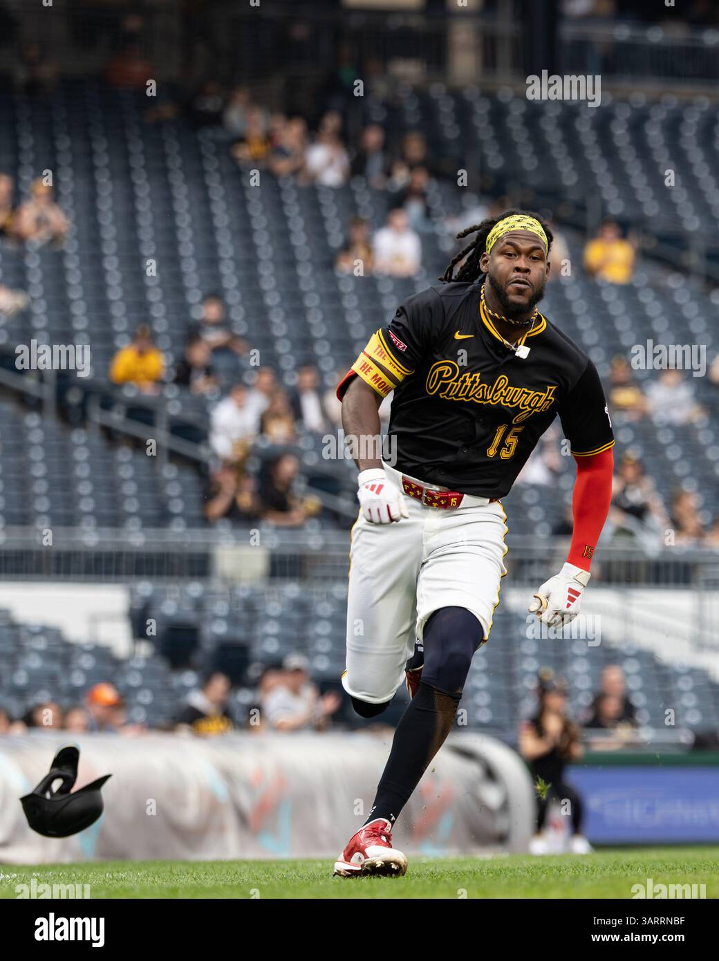 Pittsburgh Pirates outfielder Oneil Cruz loses his helmet as he scores ...