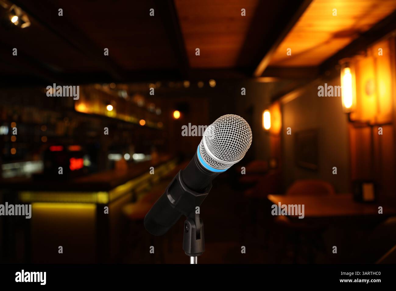 Microphone on stage in restaurant. Singer's performance Stock Photo - Alamy