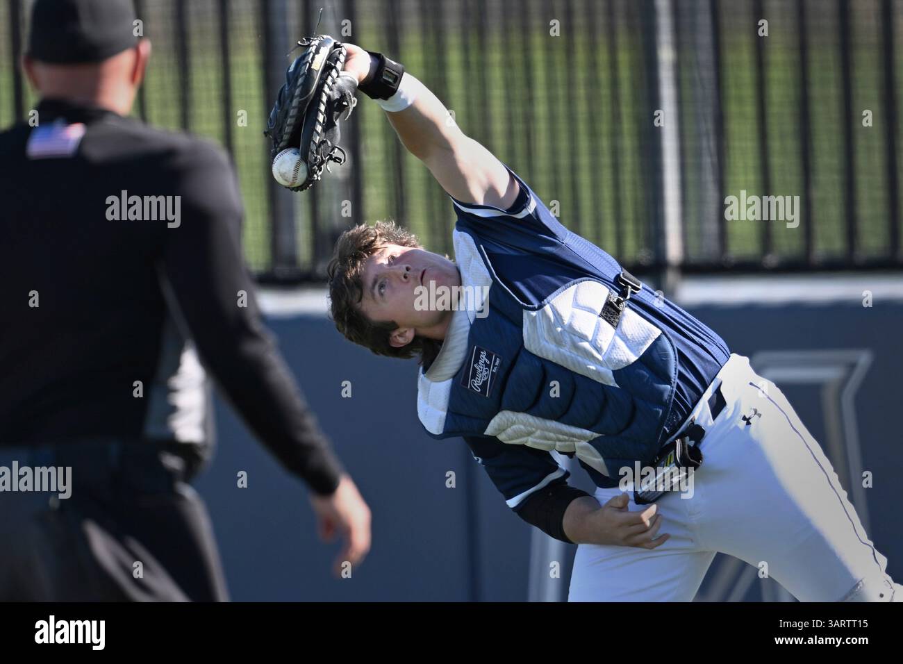 Mount St Mary's catcher Ethan Flaugher catches a foul ball but is ...