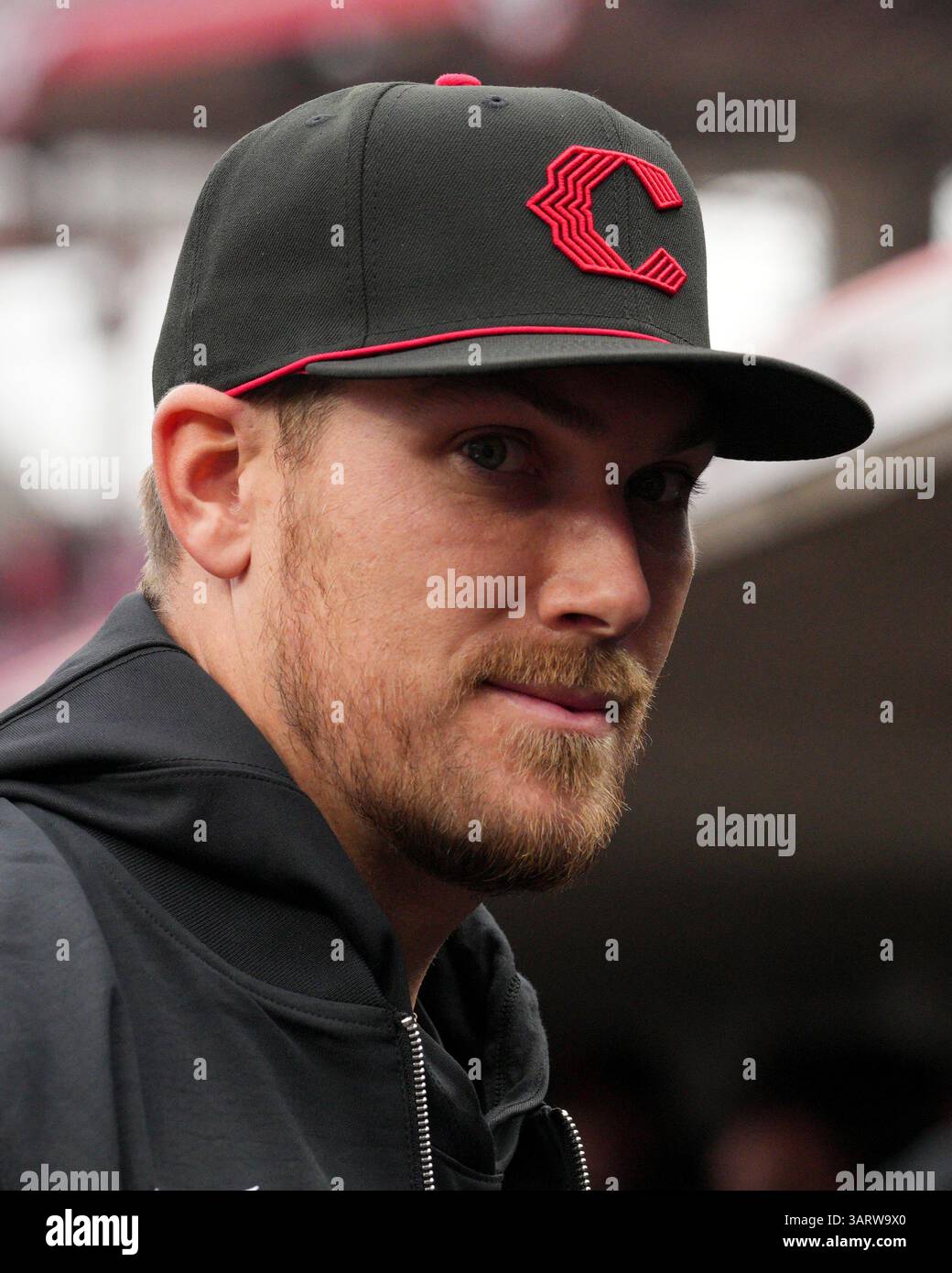 Cincinnati Reds' Tyler Stephenson stands in the dugout during a ...