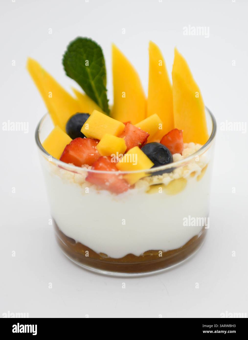 Mango Yogurt with fresh mango and blueberry on white background Stock ...