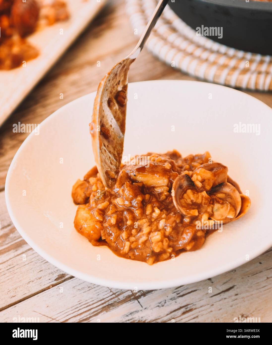 Brothy rice with premium seafood. A gourmet restaurant dish Stock Photo ...
