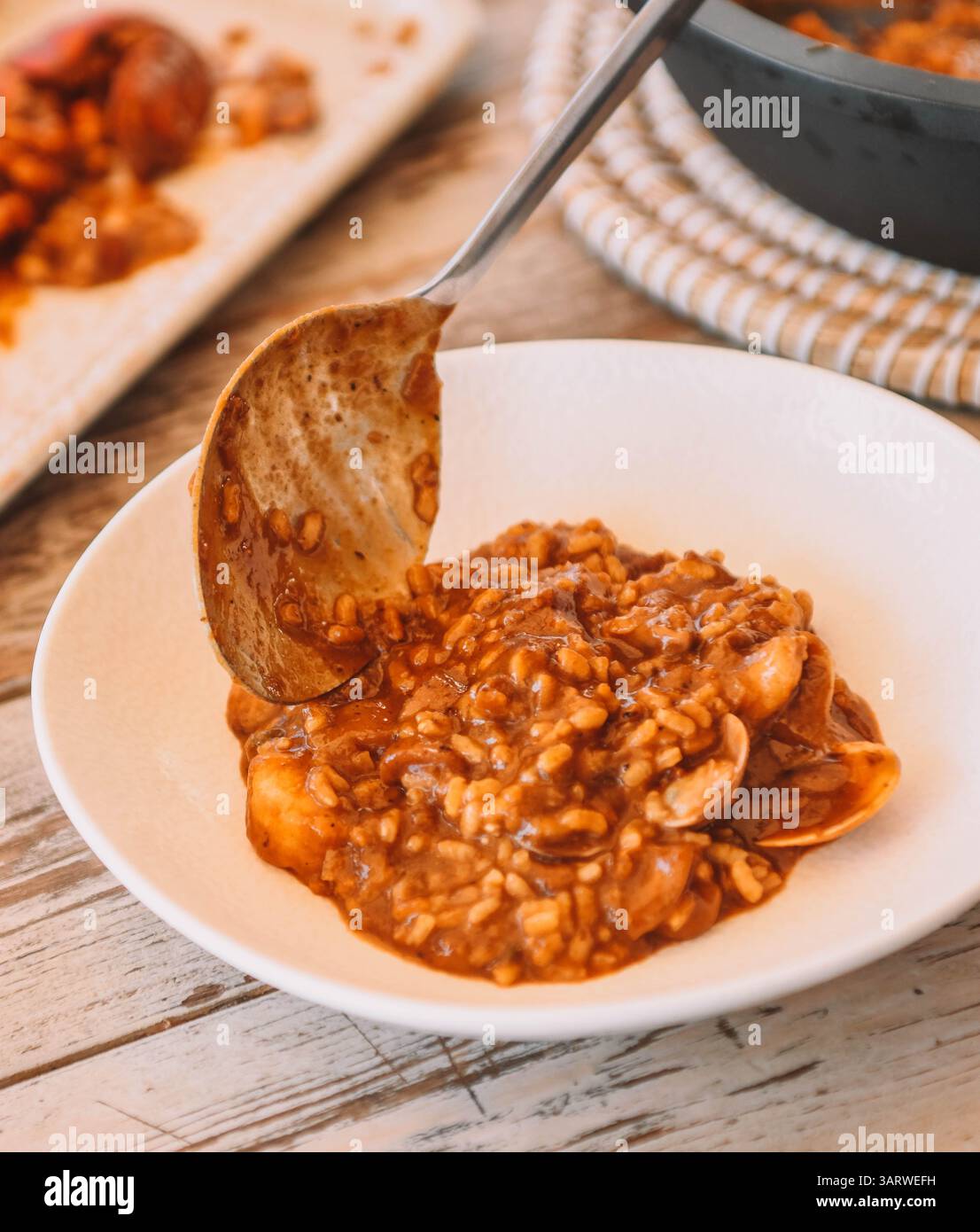 Brothy rice with premium seafood. A gourmet restaurant dish Stock Photo ...