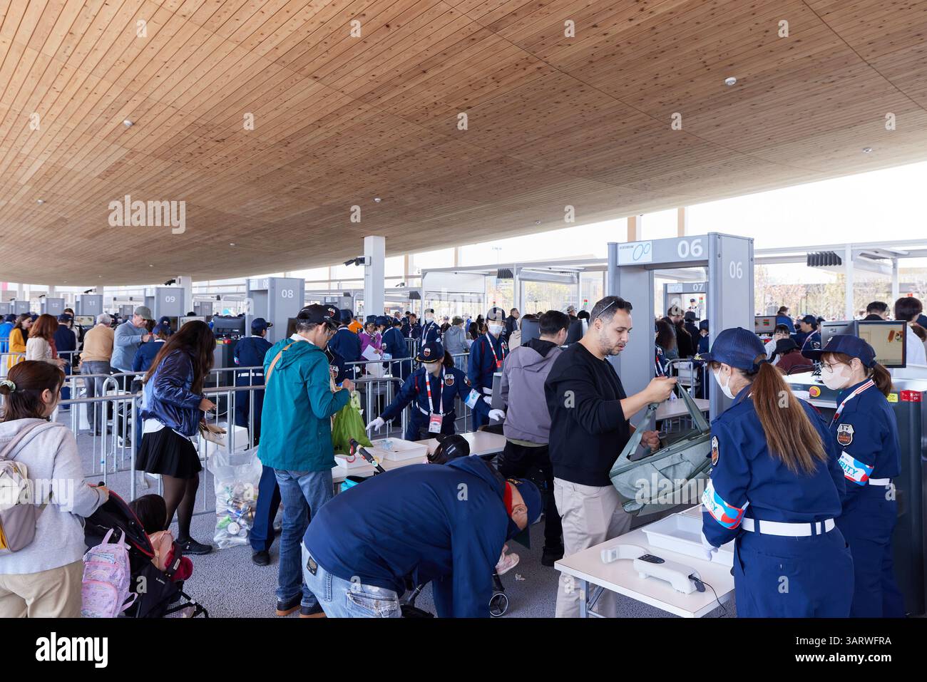 Visitors enter the Osaka Expo site through the baggage inspection at ...