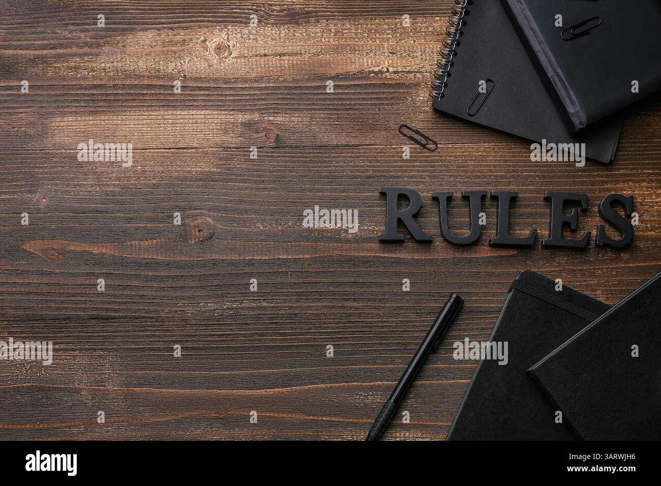 Word RULES with notebooks on wooden background Stock Photo - Alamy