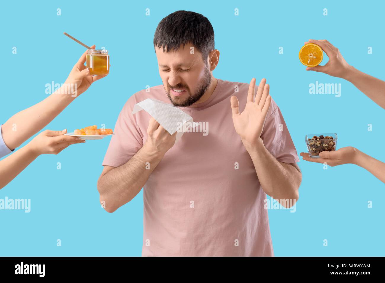 Sneezing young man and female hands with different products on blue ...