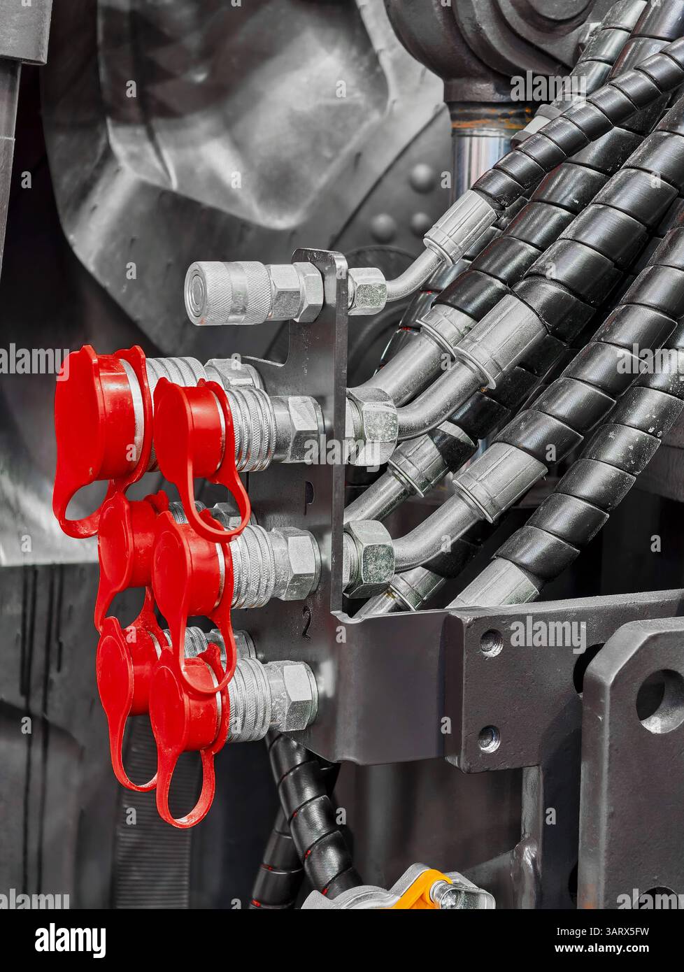 Hydraulic connectors and hoses in a modern industrial setting showcase ...